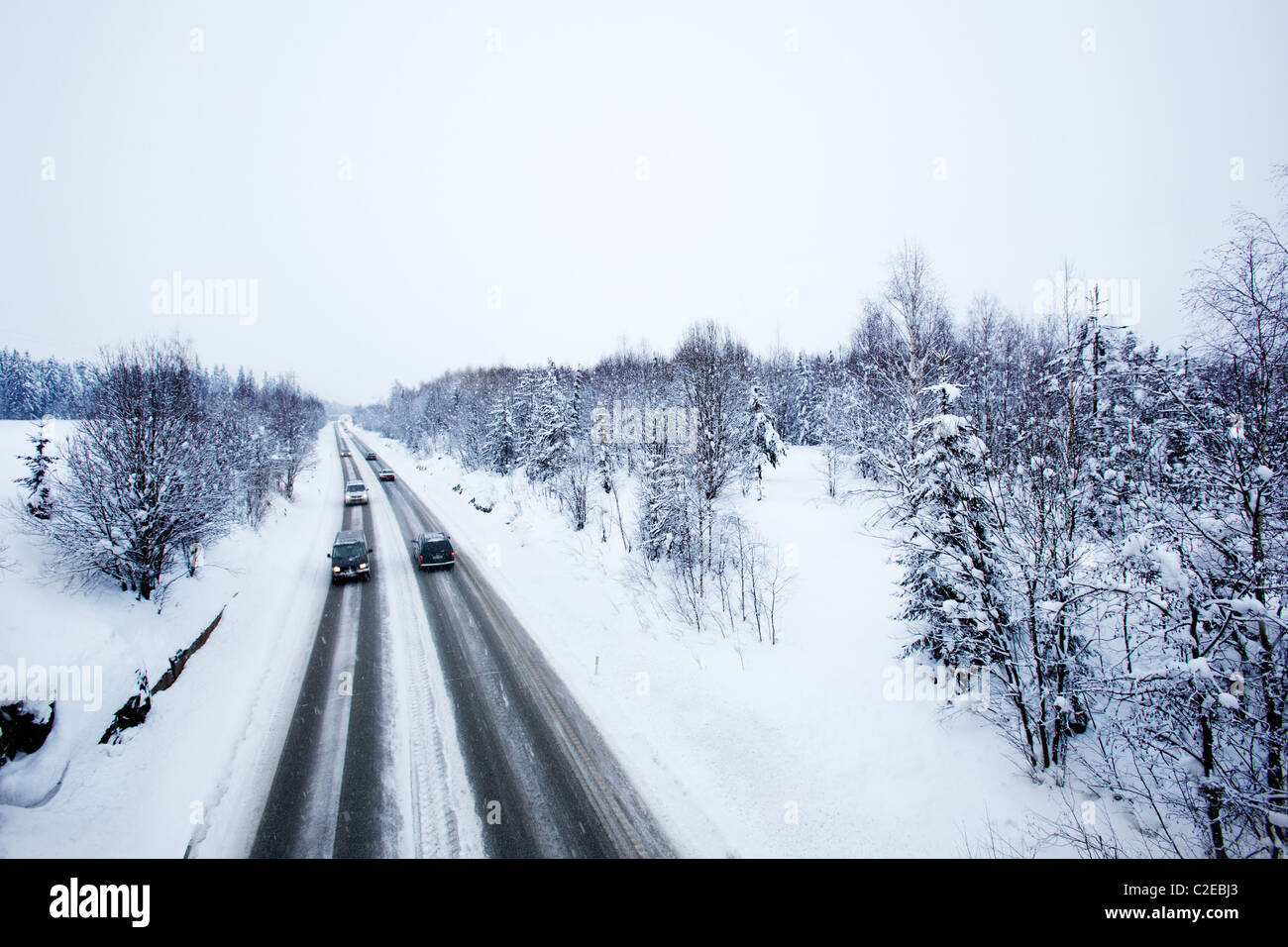 A road in winter during a snow storm Stock Photo - Alamy