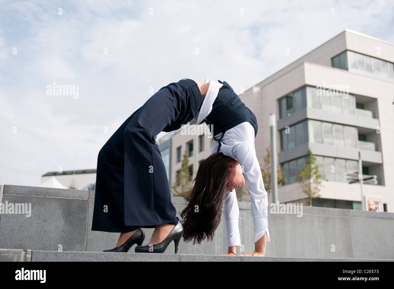 Flexibility - business woman outdoors Stock Photo - Alamy