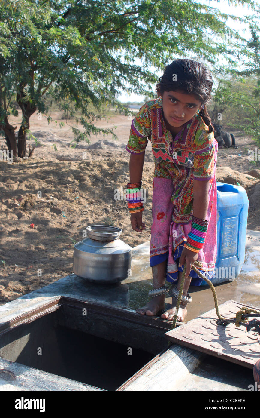 Girl collecting water hi-res stock photography and images - Alamy