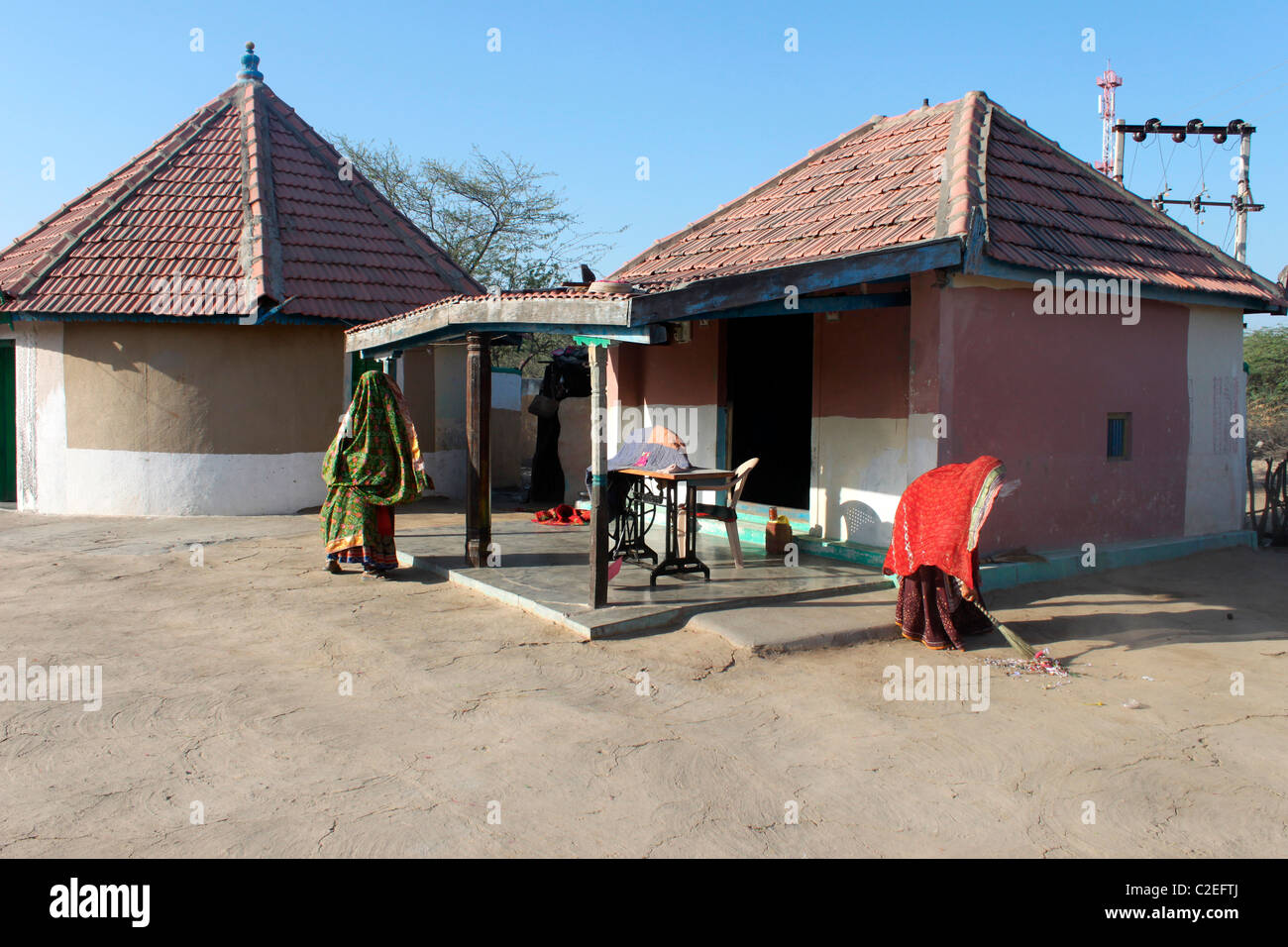 Women cleaning their huts in Kutch, Gujarat, India Stock Photo - Alamy
