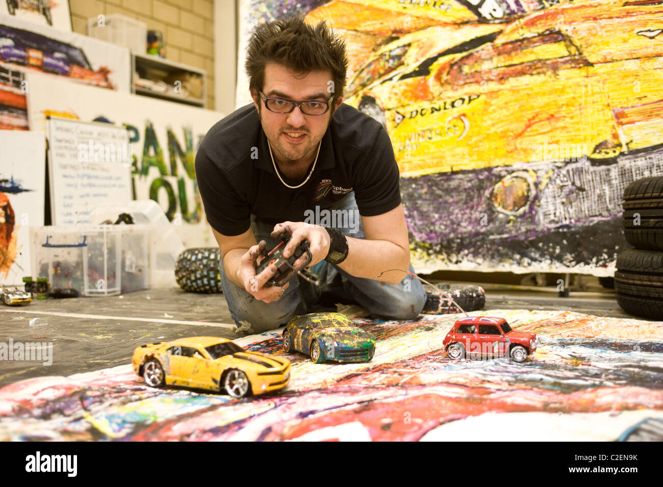11.4.2011 Ian Cook who paints cars using remote controlled toy cars and ...