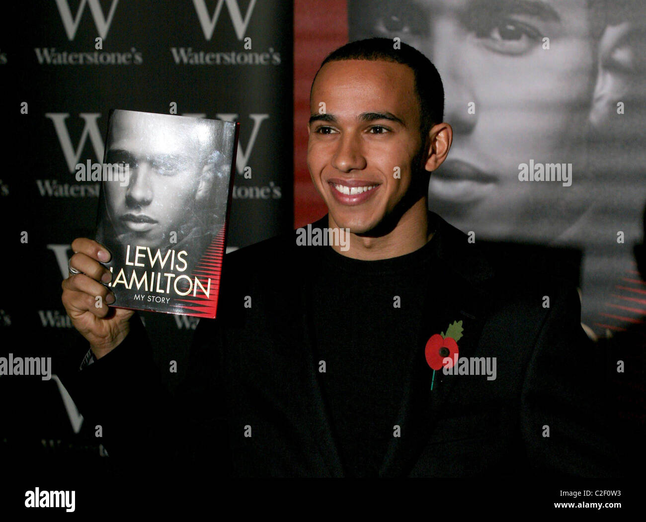Formula One driver Lewis Hamilton signs copies of his new autobiography ...