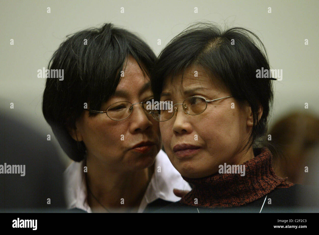 Yu Lin and Gao Gin Sheng listening to Yahoo executives speak to the ...