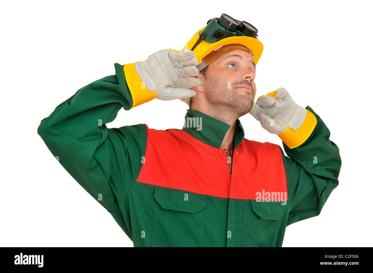 Construction worker covering his ears Stock Photo - Alamy