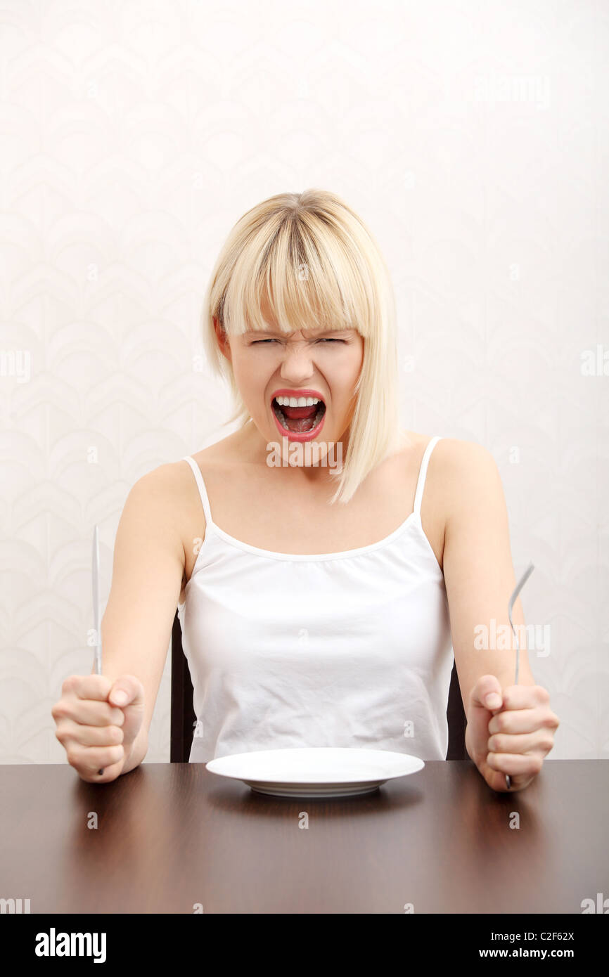 Hungry woman screaming Stock Photo - Alamy
