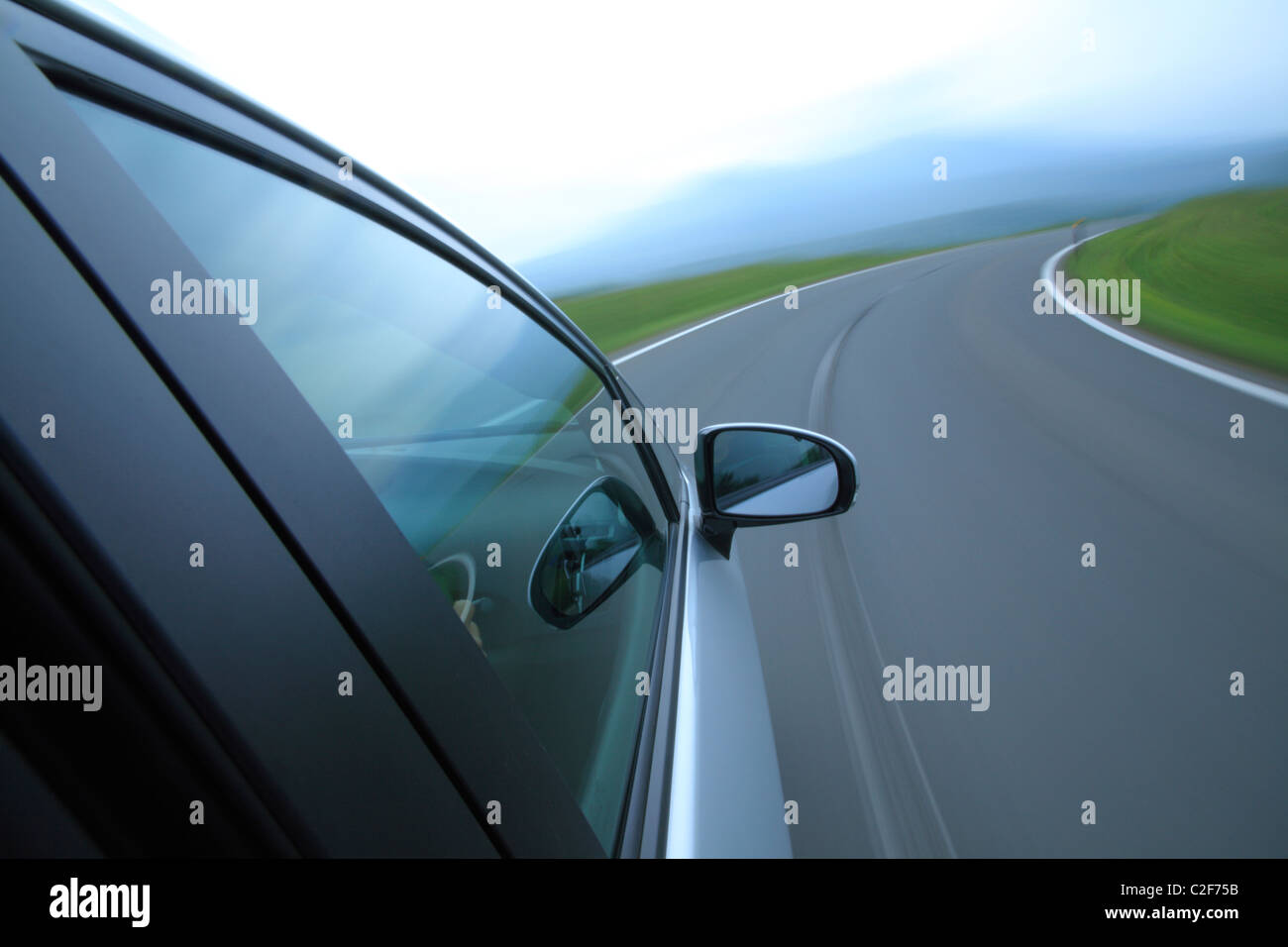 car driving fast into forest Stock Photo - Alamy