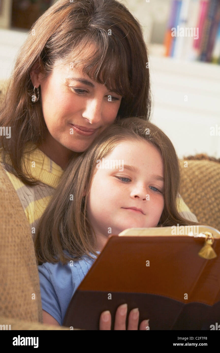 A Mother And Daughter Read The Bible Together Stock Photo - Alamy