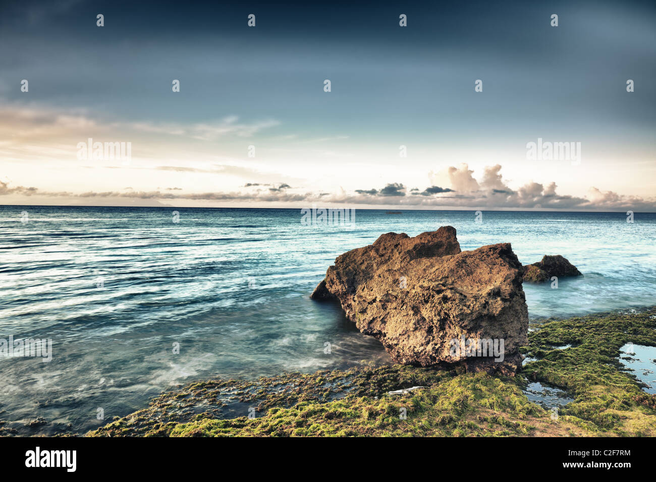 Beautiful view of the sea. Stone on the foreground Stock Photo - Alamy