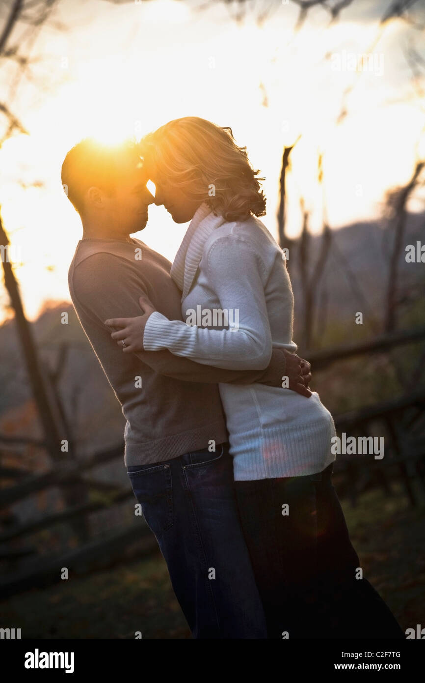 A Couple Standing In An Embrace Stock Photo - Alamy