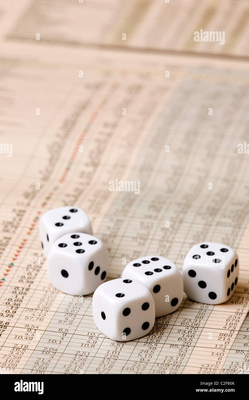 Dice sitting on a stock market chart Stock Photo - Alamy