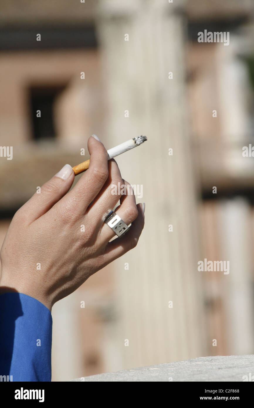 woman smoking cigarette in rome italy Stock Photo - Alamy