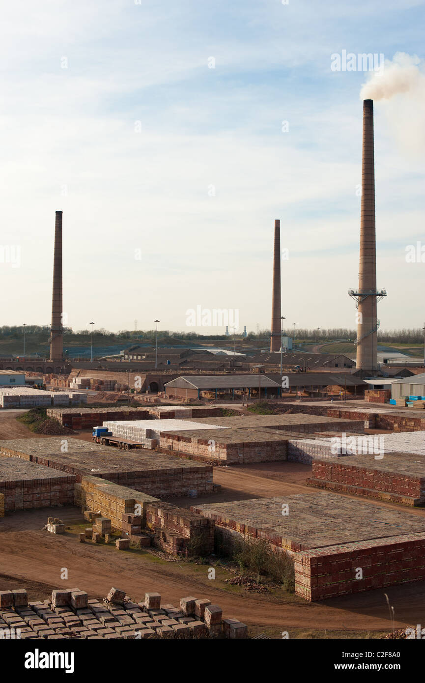 View of a huge factory with fuming chimneys Stock Photo - Alamy