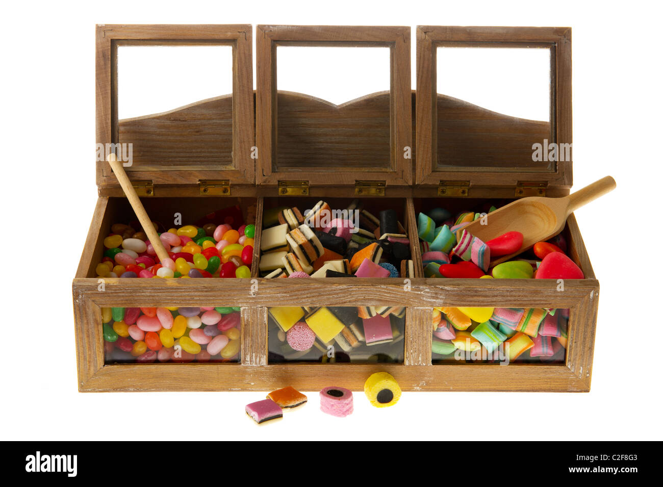 Wooden candy bar with assortment sweets isolated over white Stock Photo ...