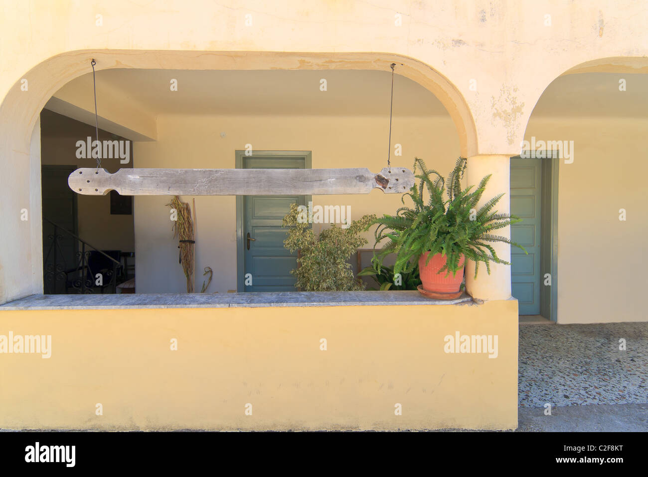 Pluck of wood and hammer used as prayer bell in monastery Stock Photo ...
