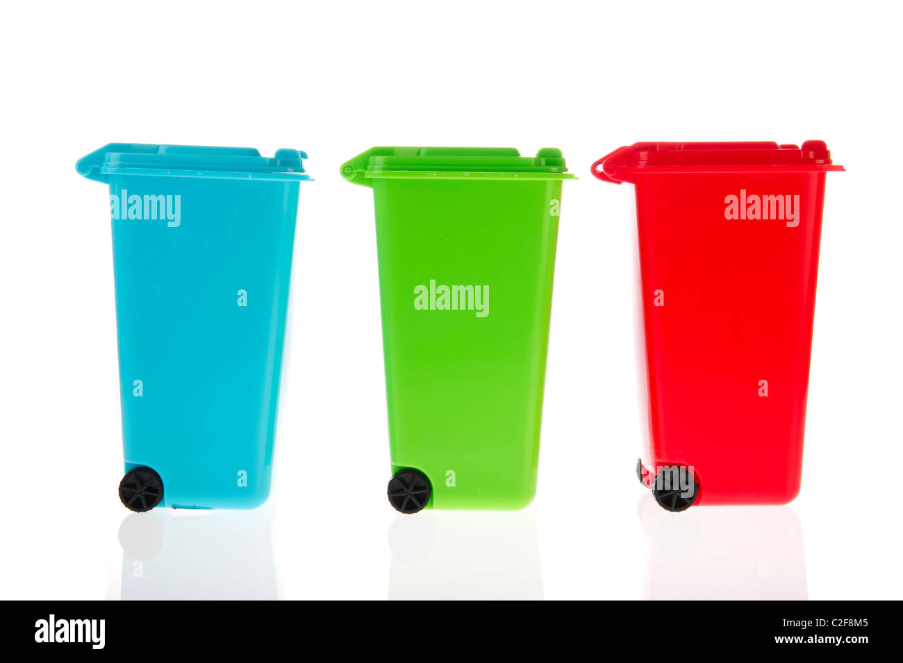 Three plastic rolling containers for garbage in a row Stock Photo - Alamy