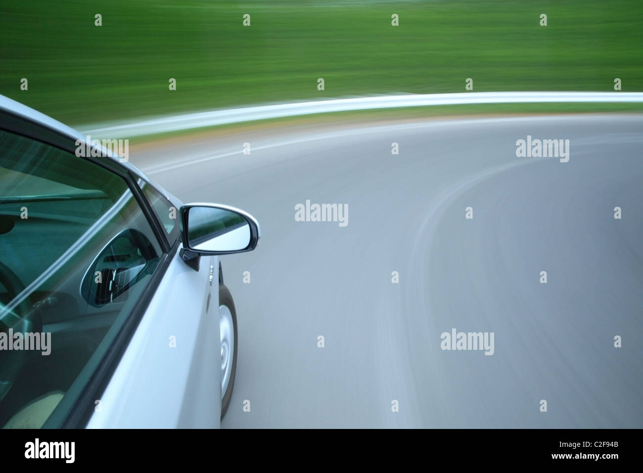 car driving fast into forest Stock Photo - Alamy