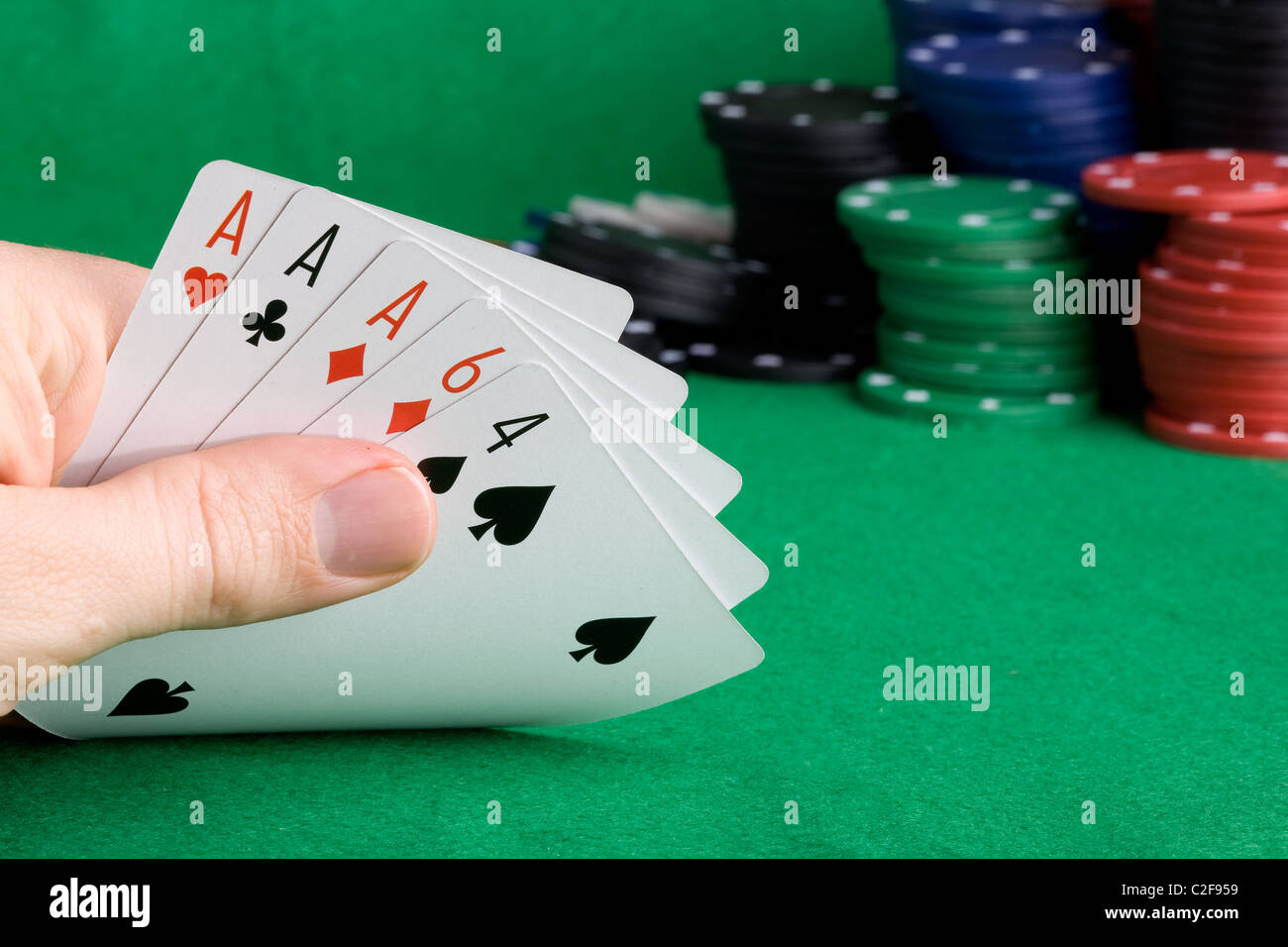 A poker hand with three of a kind Aces Stock Photo - Alamy