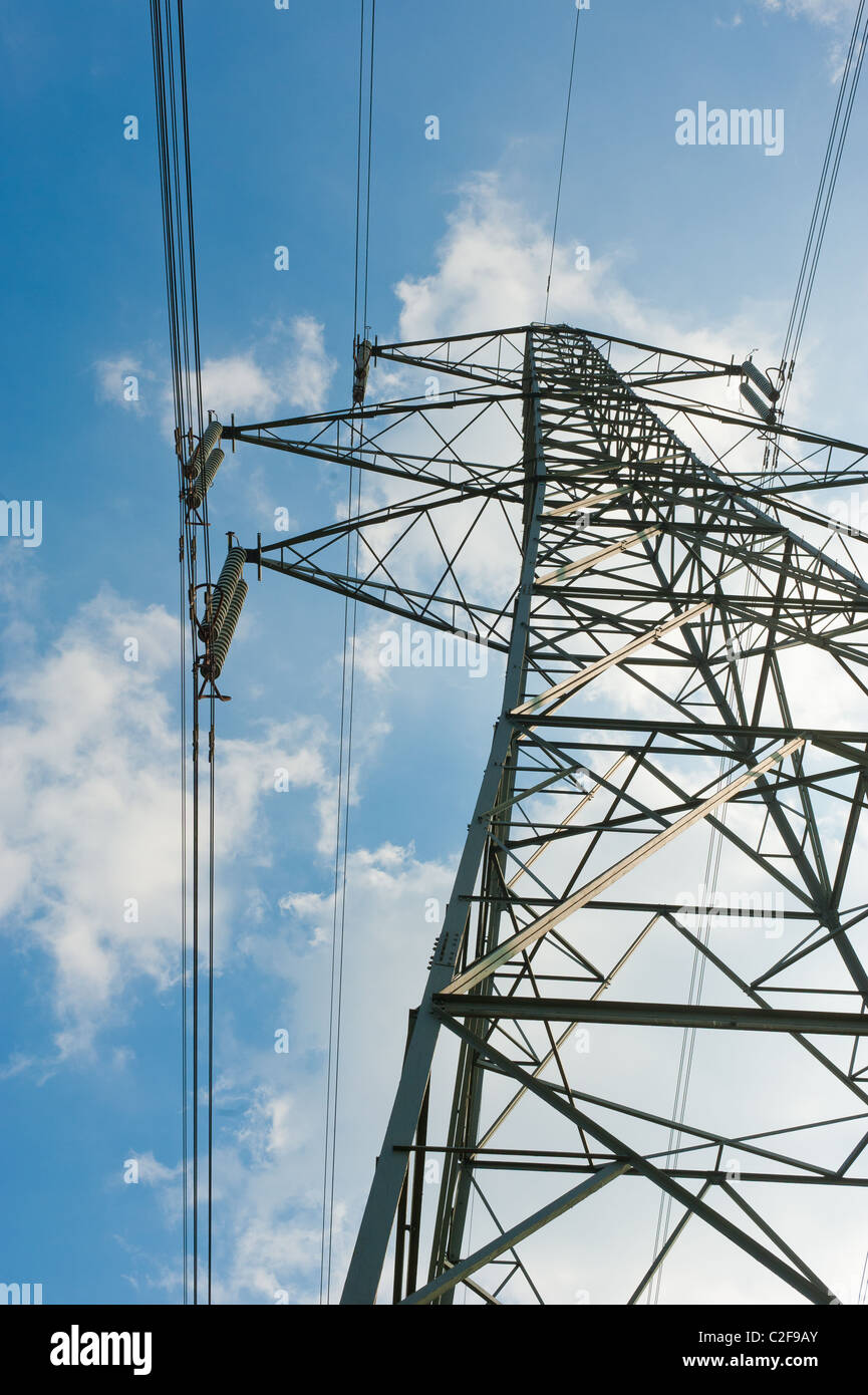 Low angle take of a high tension pylon against the sky Stock Photo - Alamy