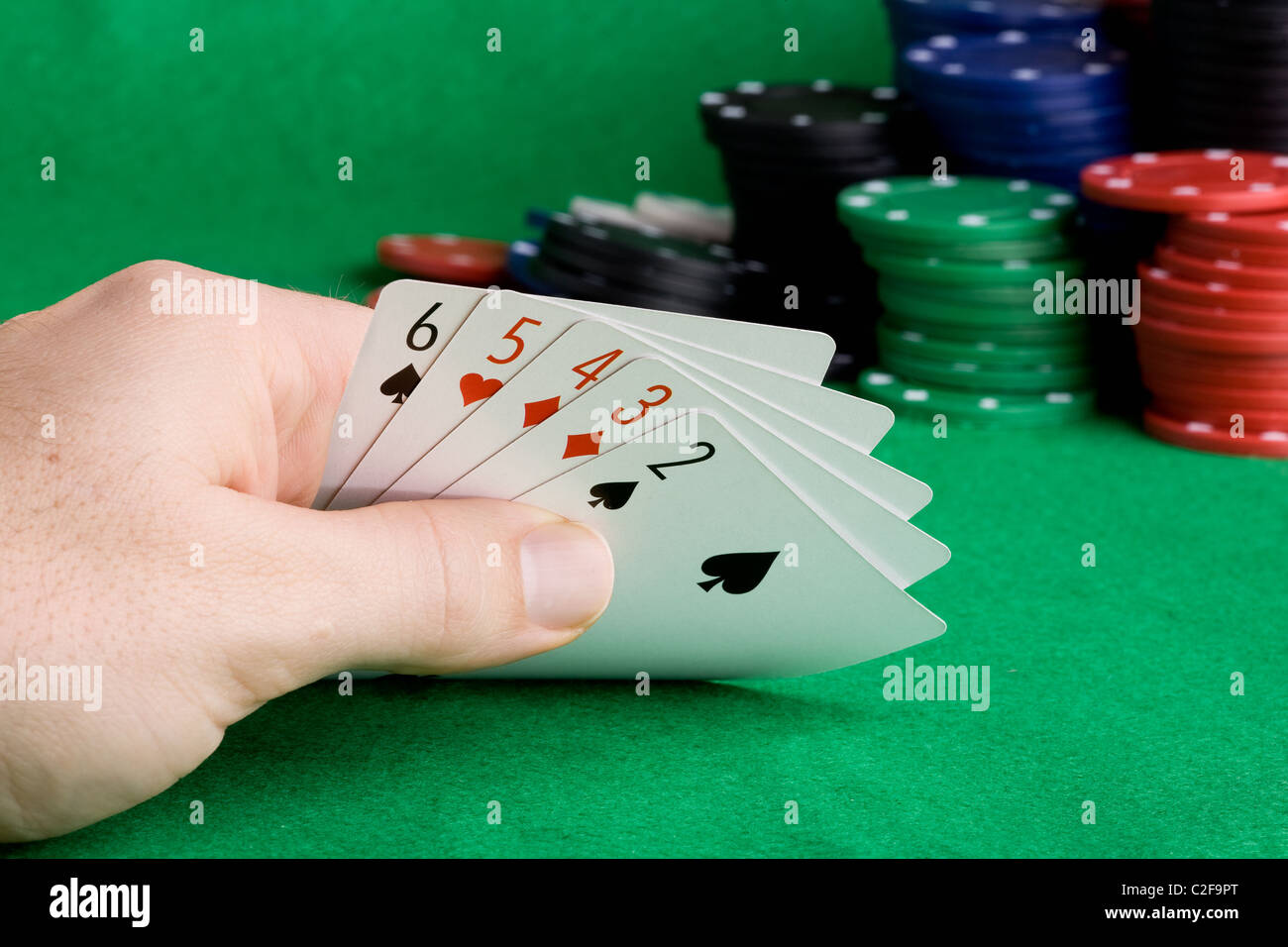 A poker hand which holds a straight Stock Photo - Alamy