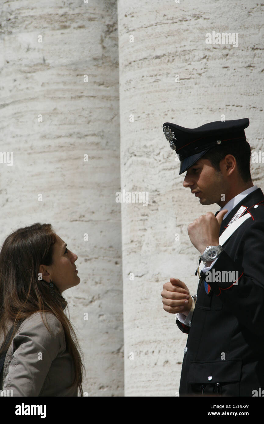 carabinieri police man talking to young woman in the vatican square ...