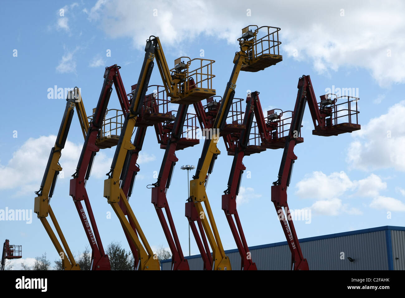 Blue cherry pickers hi-res stock photography and images - Alamy