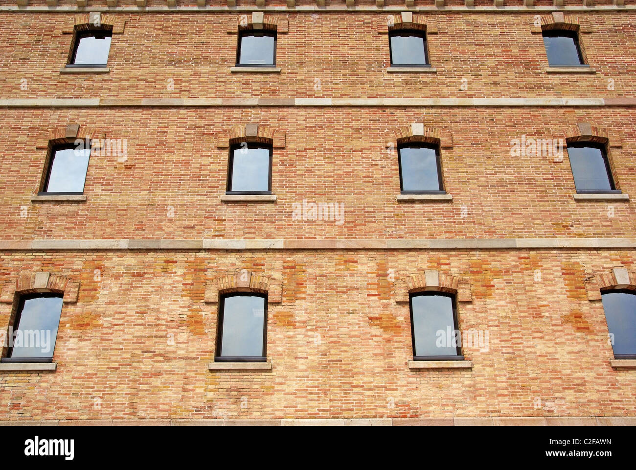 Brick wall with windows as background or backdrop Stock Photo - Alamy