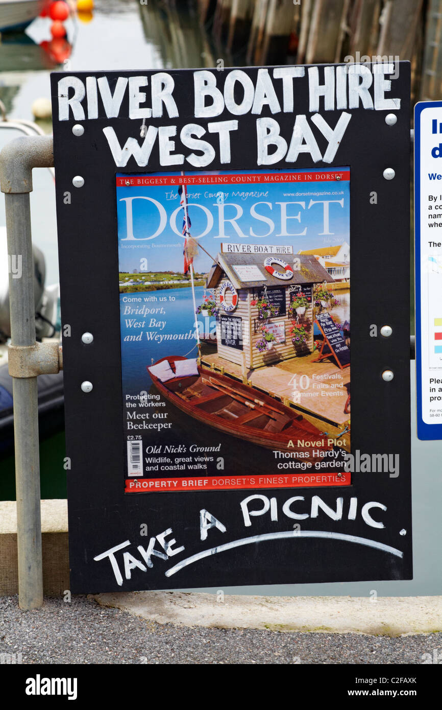 poster advertising river boat hire at West Bay Stock Photo - Alamy