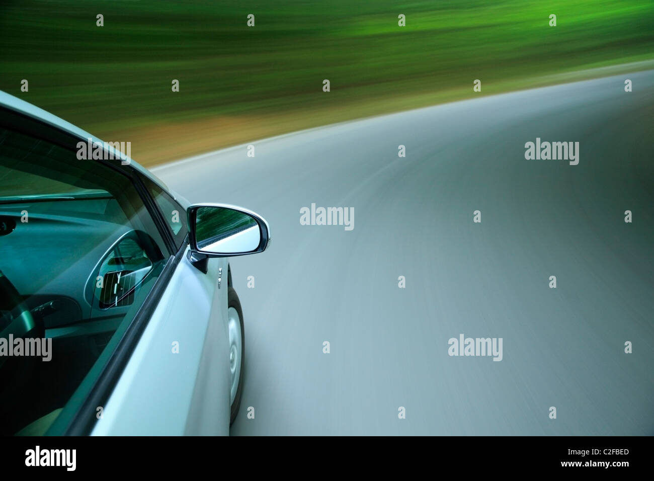 car driving fast into forest Stock Photo - Alamy