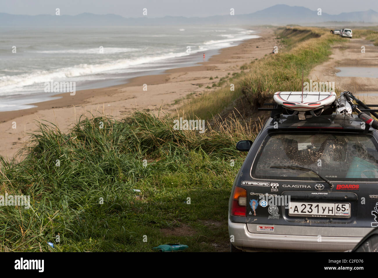 People enjoy the beach in Okhotsk, Sakhalin, Russia. September 2005 ...