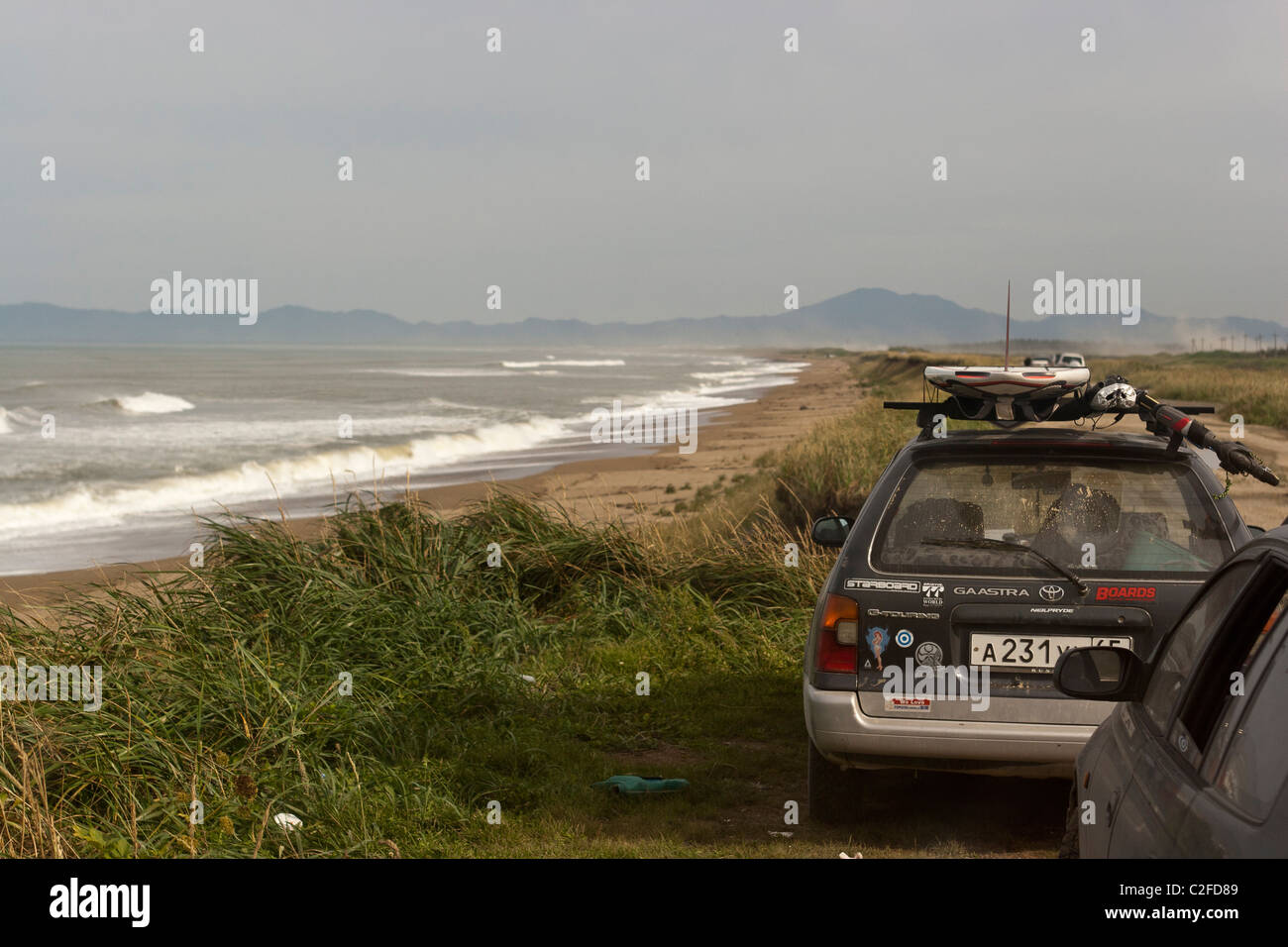 People enjoy the beach in Okhotsk, Sakhalin, Russia. September 2005 ...