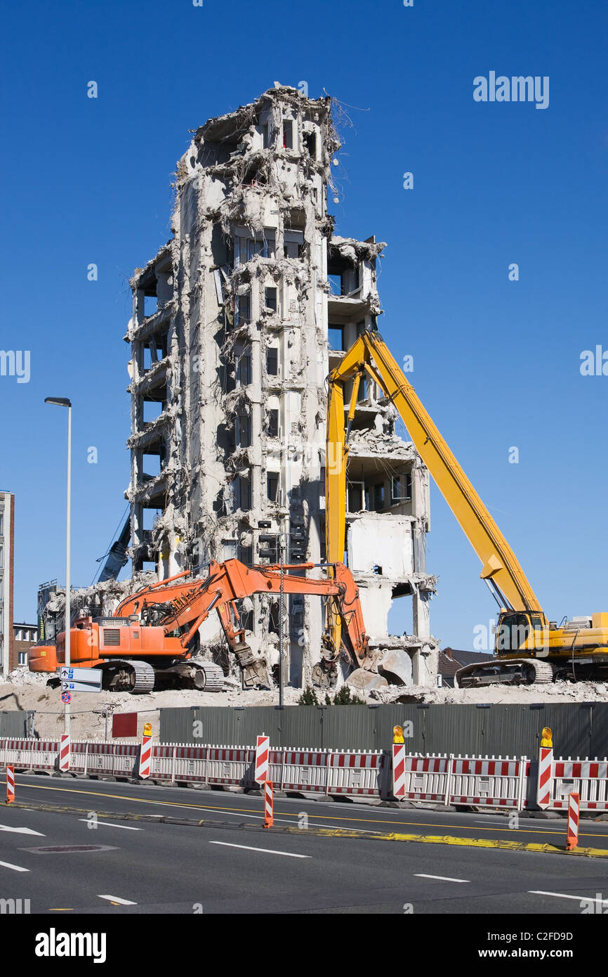 Partly demolished office building with demolition cranes Stock Photo ...