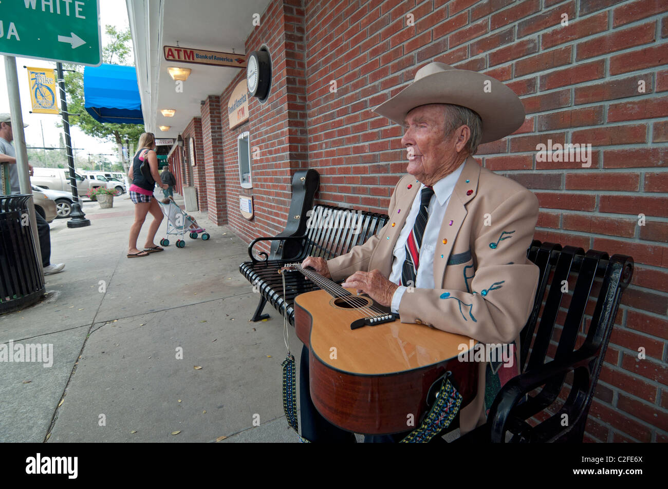 Gospel singer Lester Parrish plays his guitar on the sidewalks of the ...