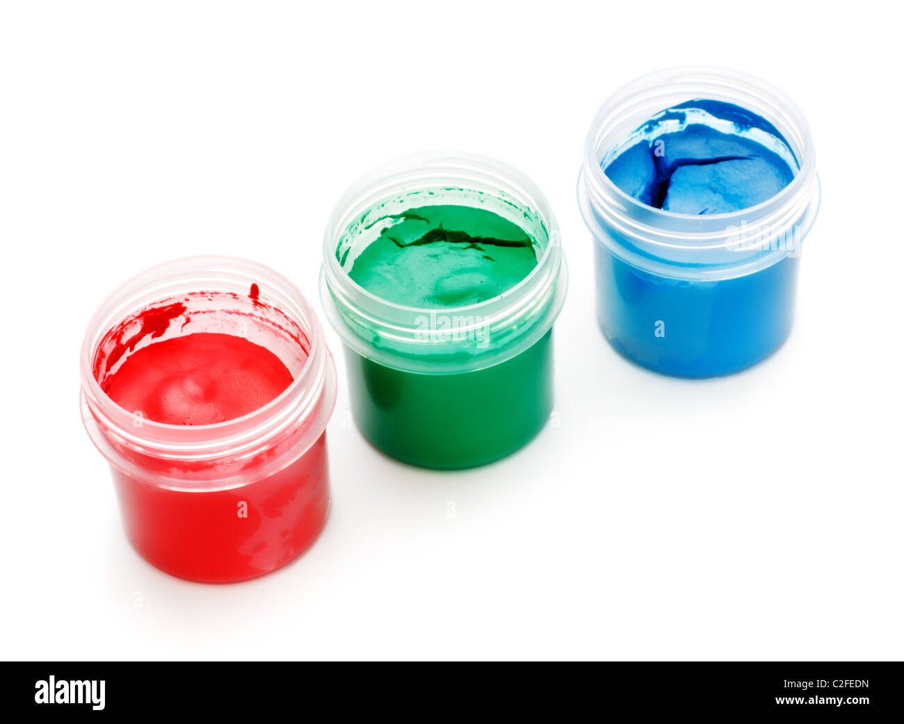 three paint cans isolated on white background Stock Photo - Alamy