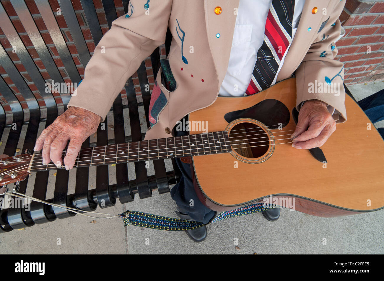 Gospel singer Lester Parrish plays his guitar on the sidewalks of the ...