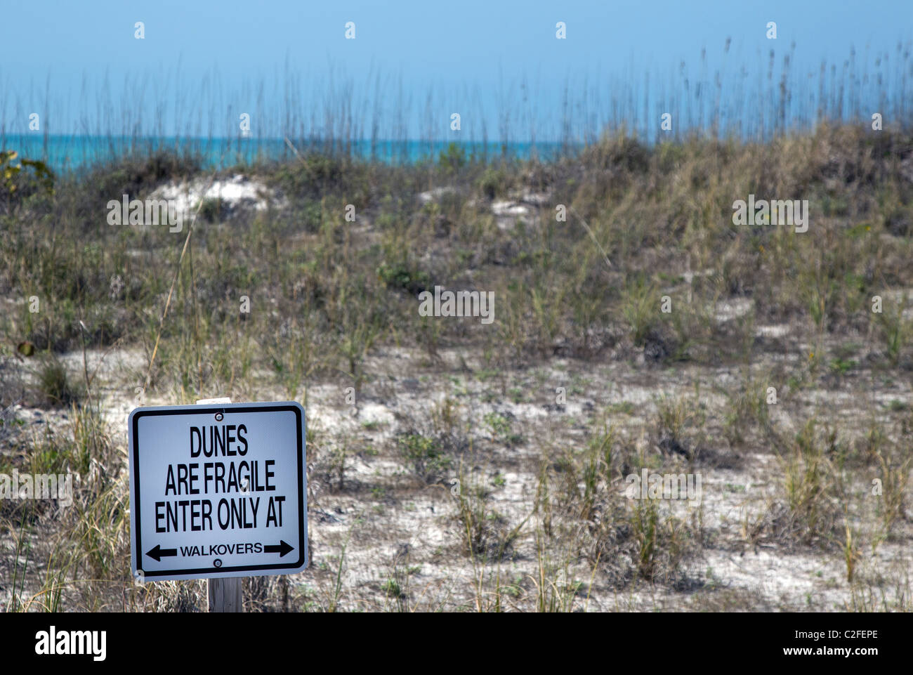 Sign warning of fragile dunes Stock Photo - Alamy