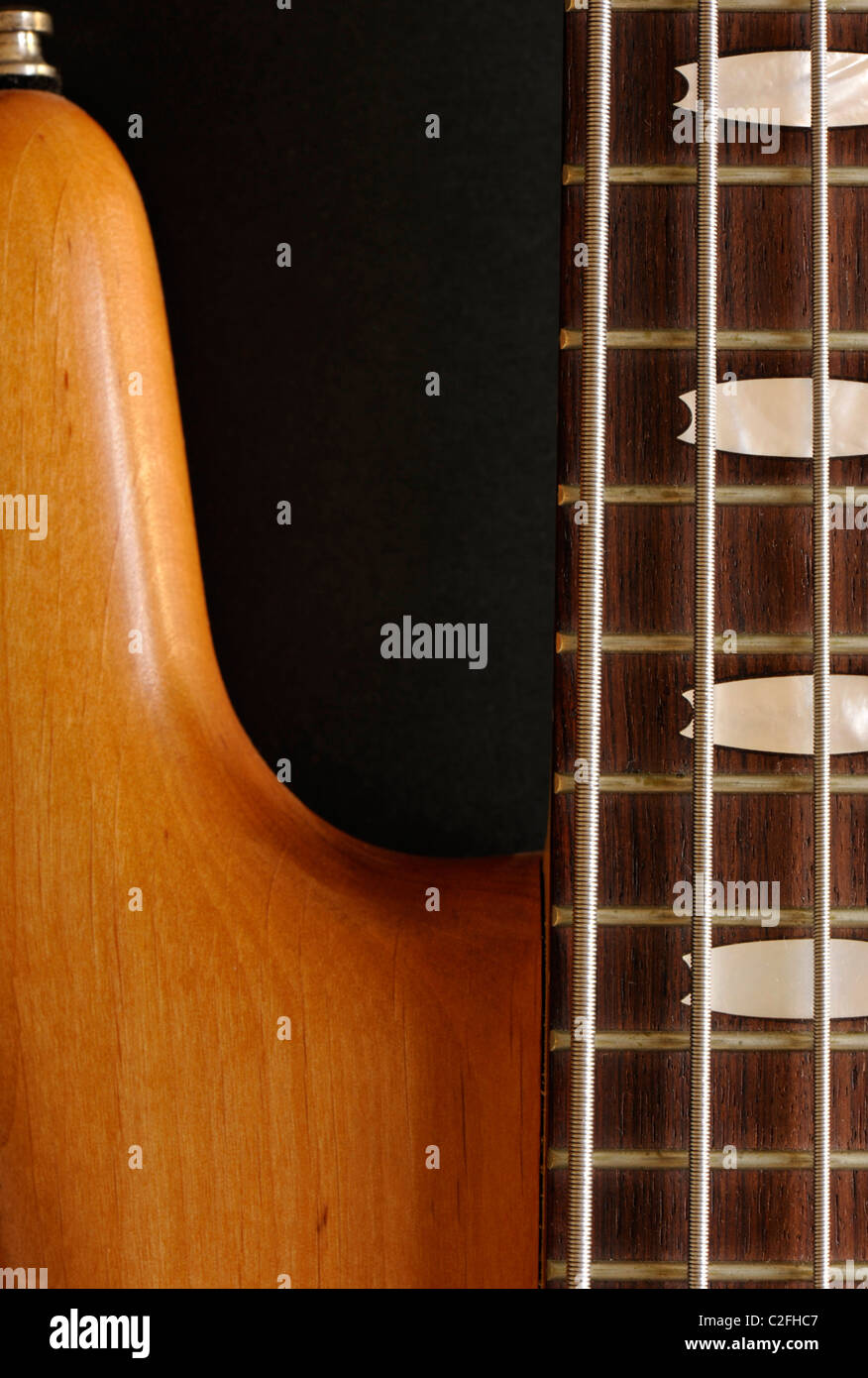 Close-up of an electric bass guitar Stock Photo - Alamy