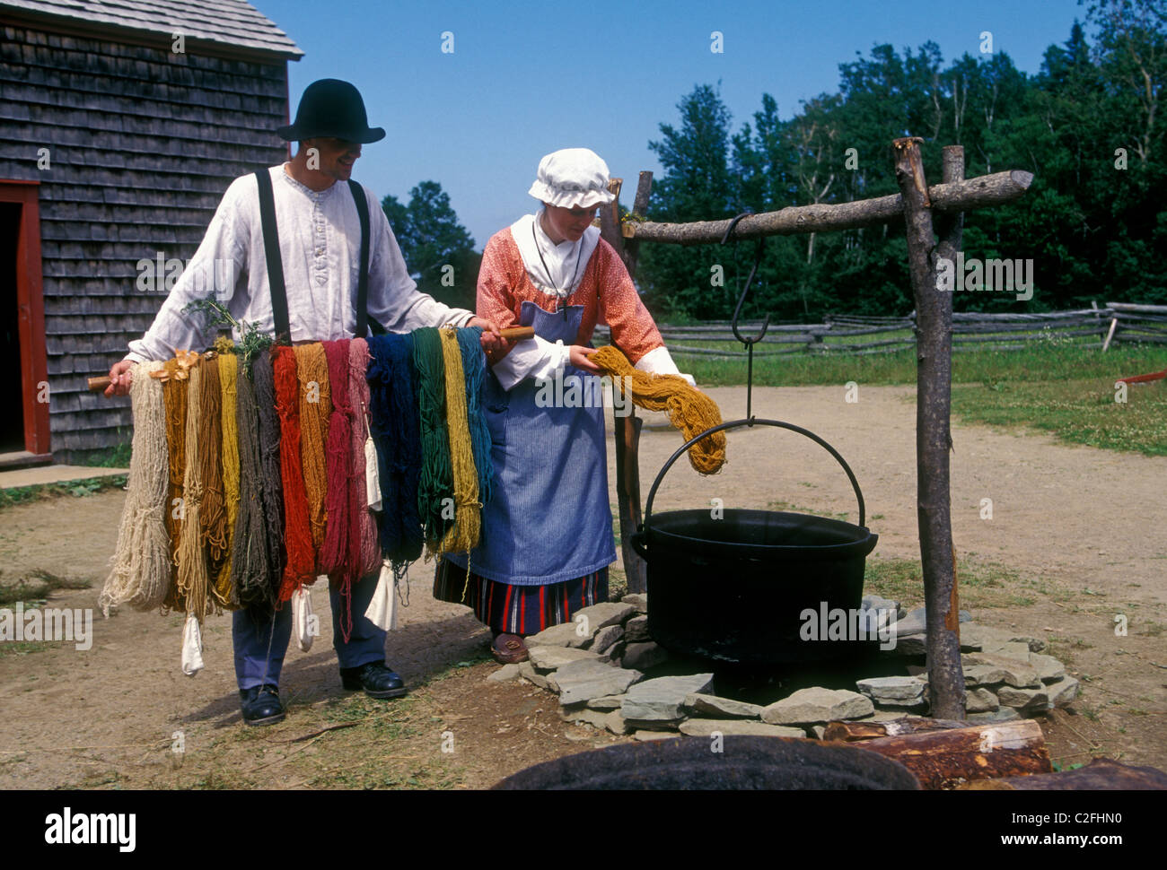 Canadian woman, Canadian man, dyeing wool, wearing period costume ...