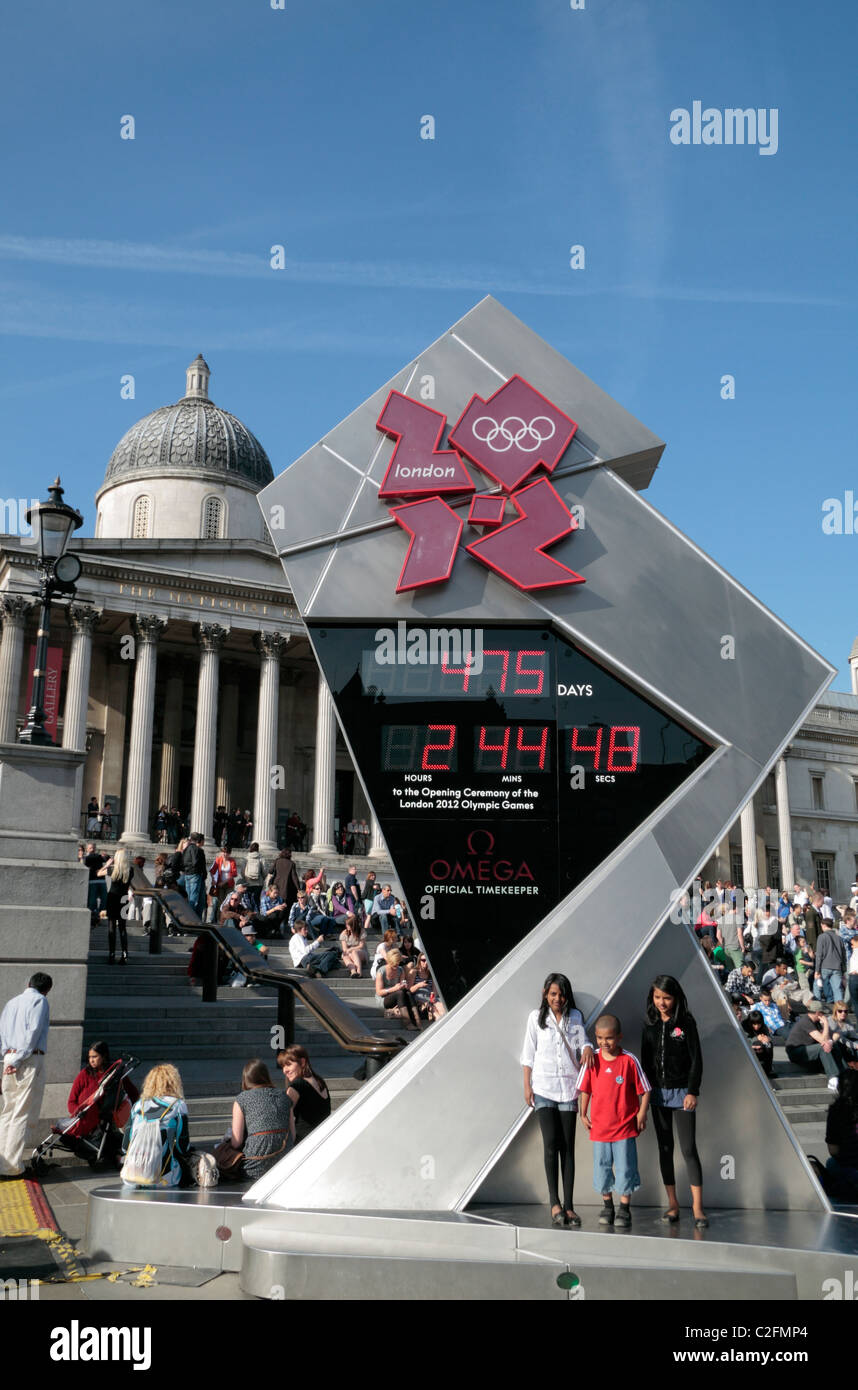 Children posing in front of the clock in Trafalgar Square London ...