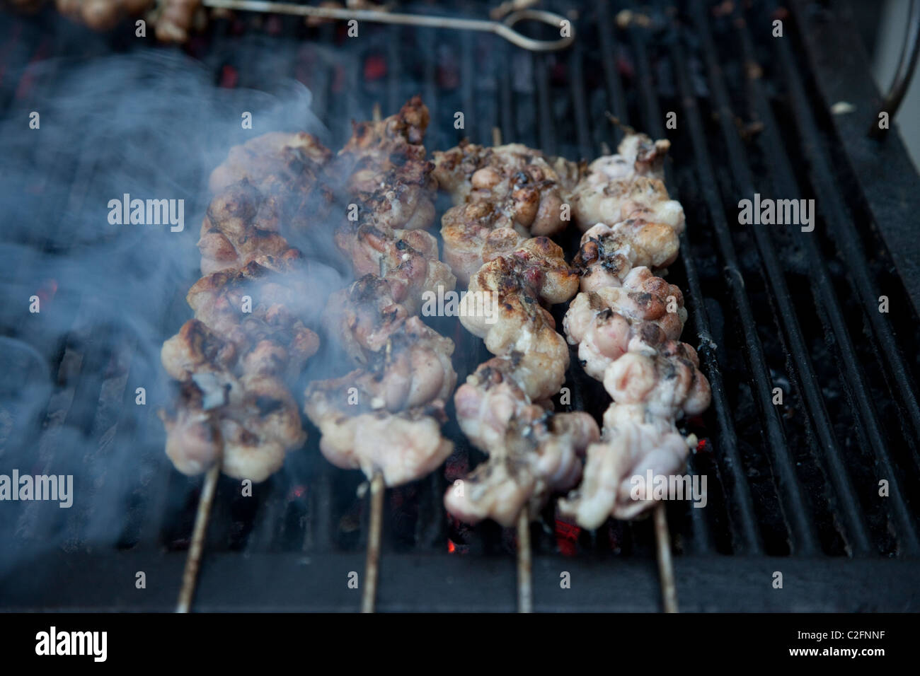 Stigghiola being cooked by the side of the road in Palermo Sicily Stock ...