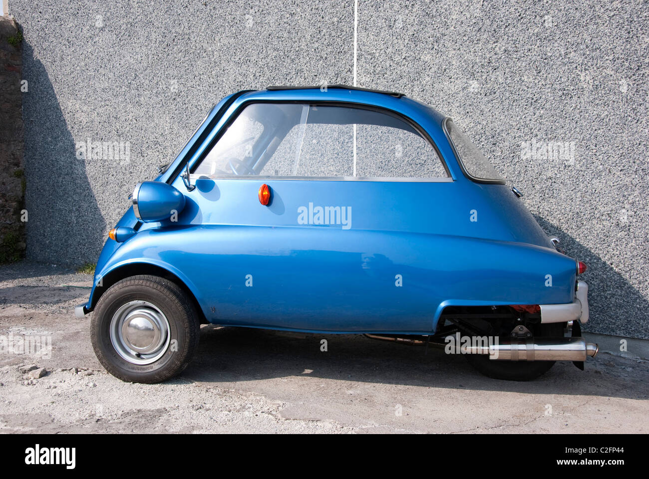 Metallic Blue Three-wheeled Microcar Stock Photo - Alamy