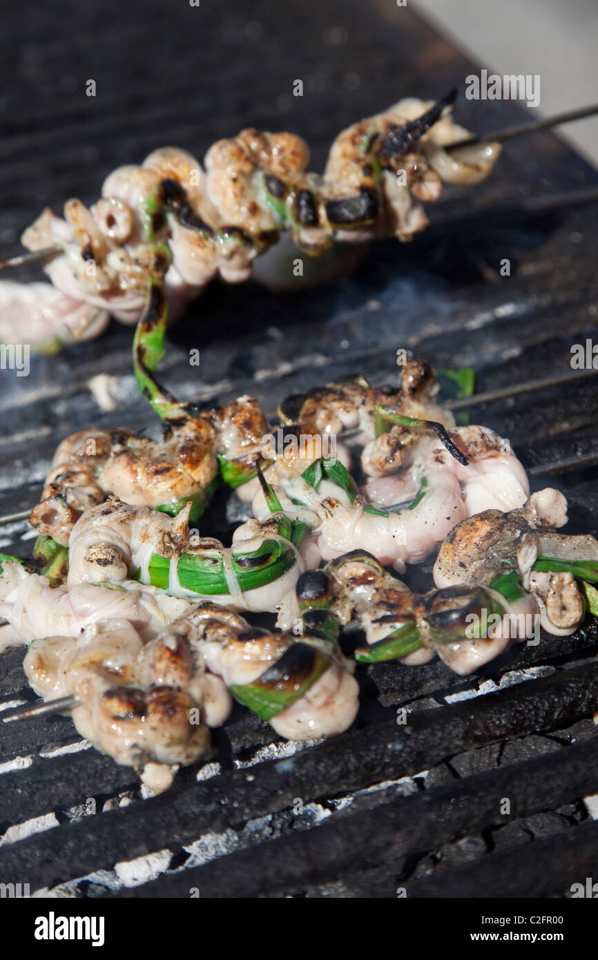 Stigghiola being cooked by the side of the road in Palermo Sicily Stock ...