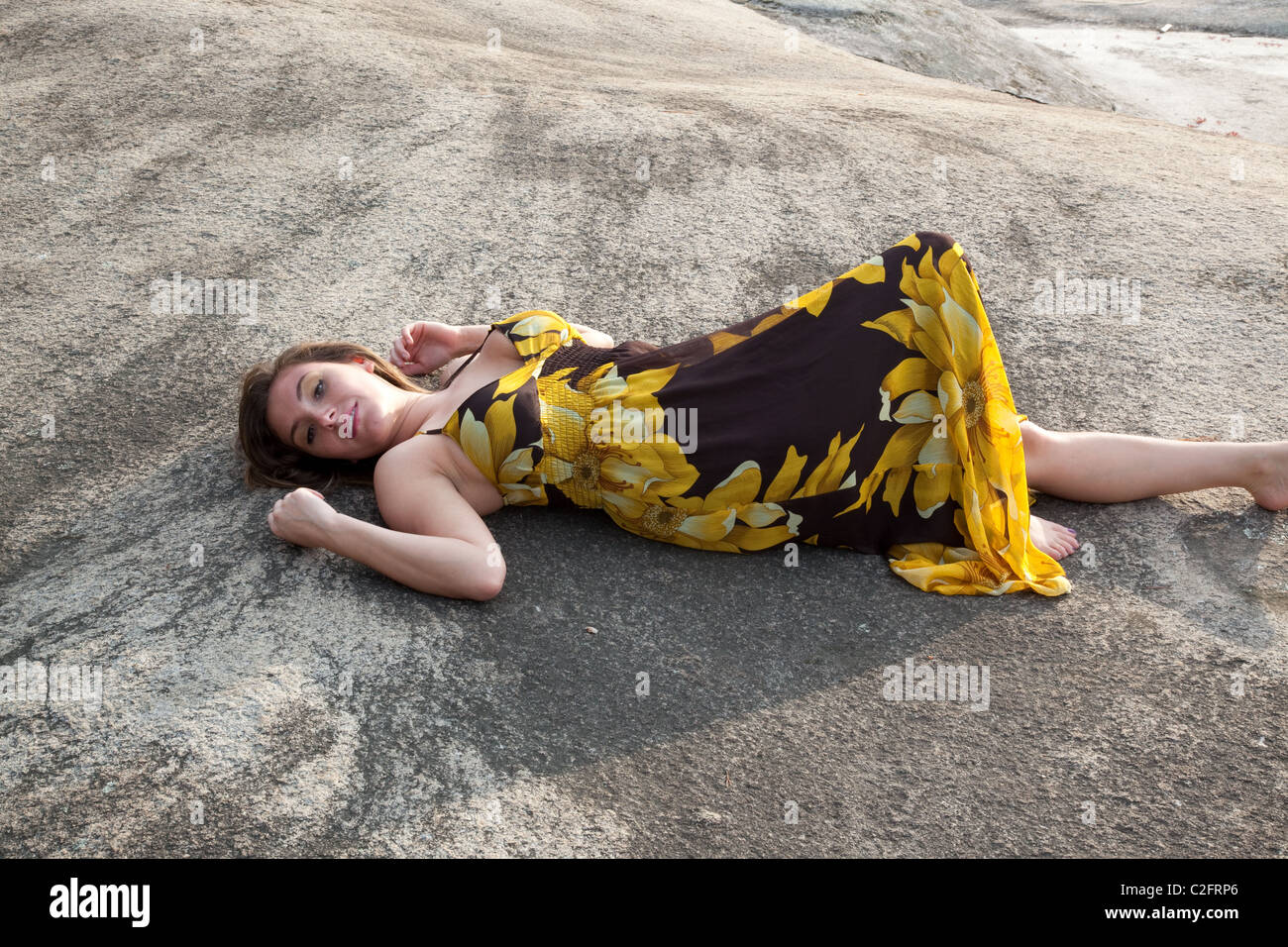Pretty woman laying on rock hi-res stock photography and images - Alamy