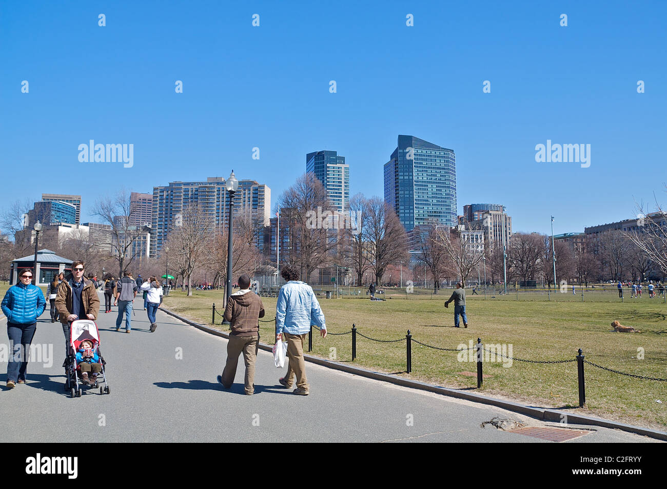 Some people stroll through Boston Common as others play sports. Opened ...