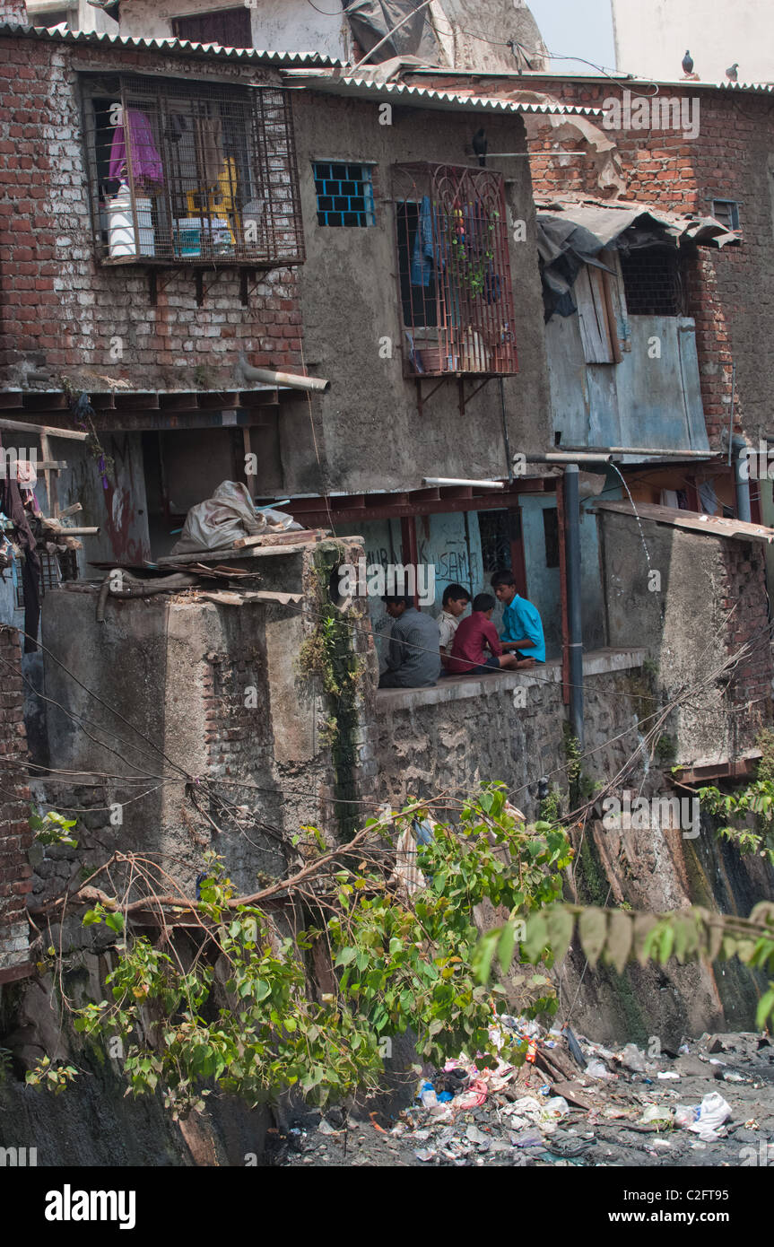Dharavi Slum shacks above a sewage filled river Stock Photo - Alamy