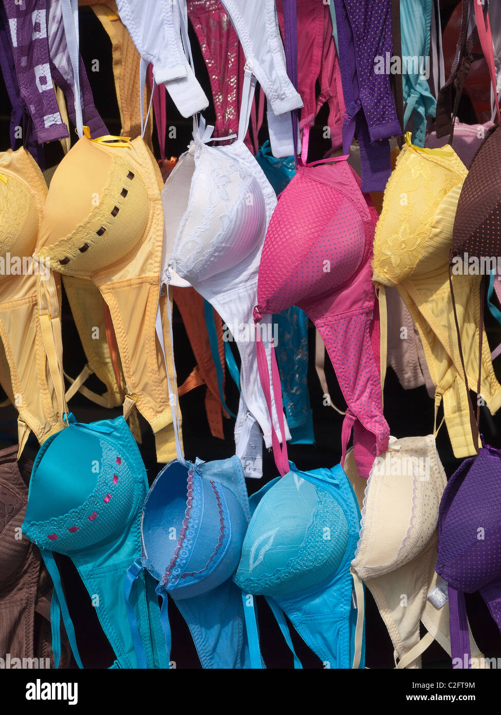 A colorful and graphic repetition of form in a display of women's bras ...