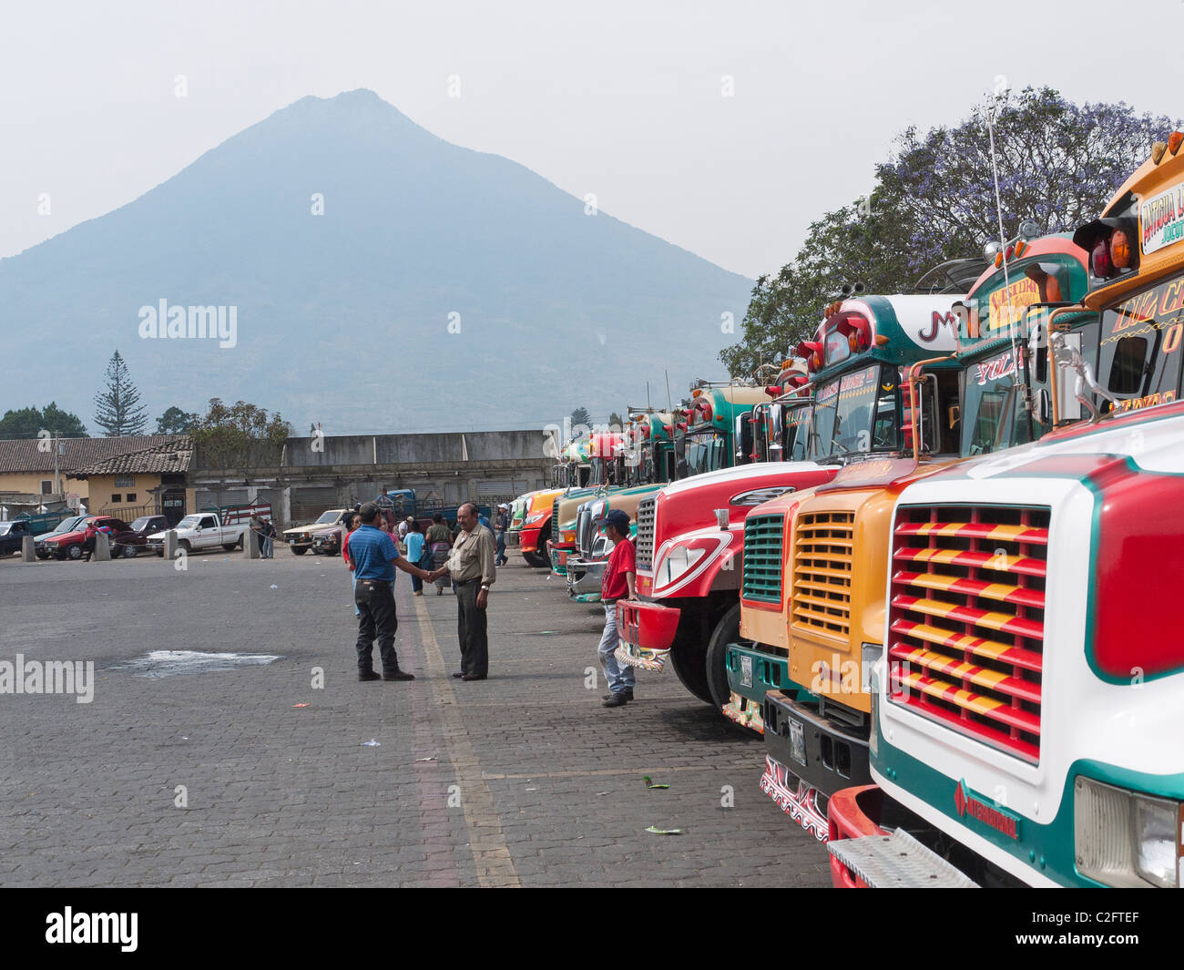 "Chicken buses" as they are known in Central America are parked outside ...