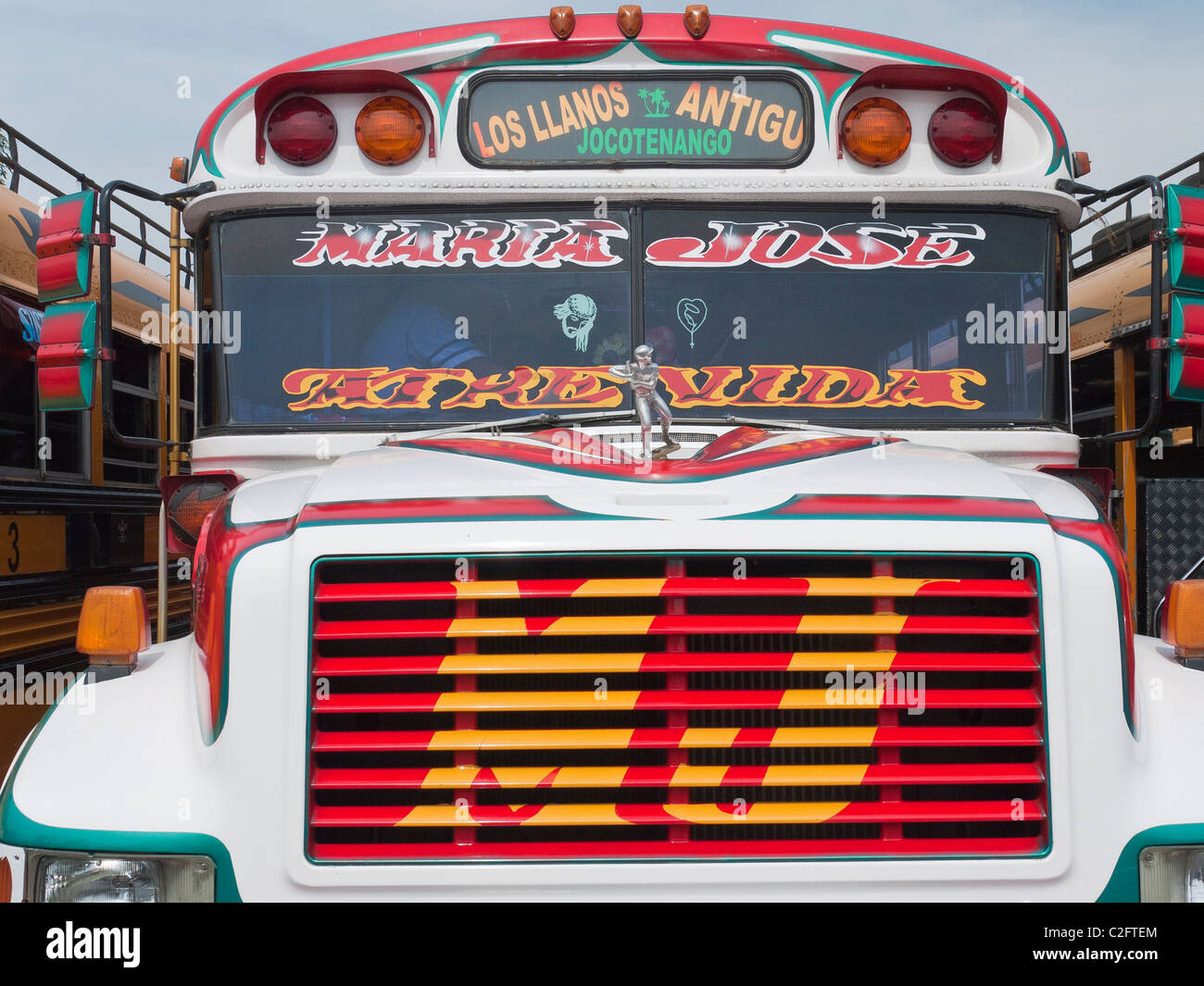 "Chicken buses" as they are known in Central America are parked outside ...
