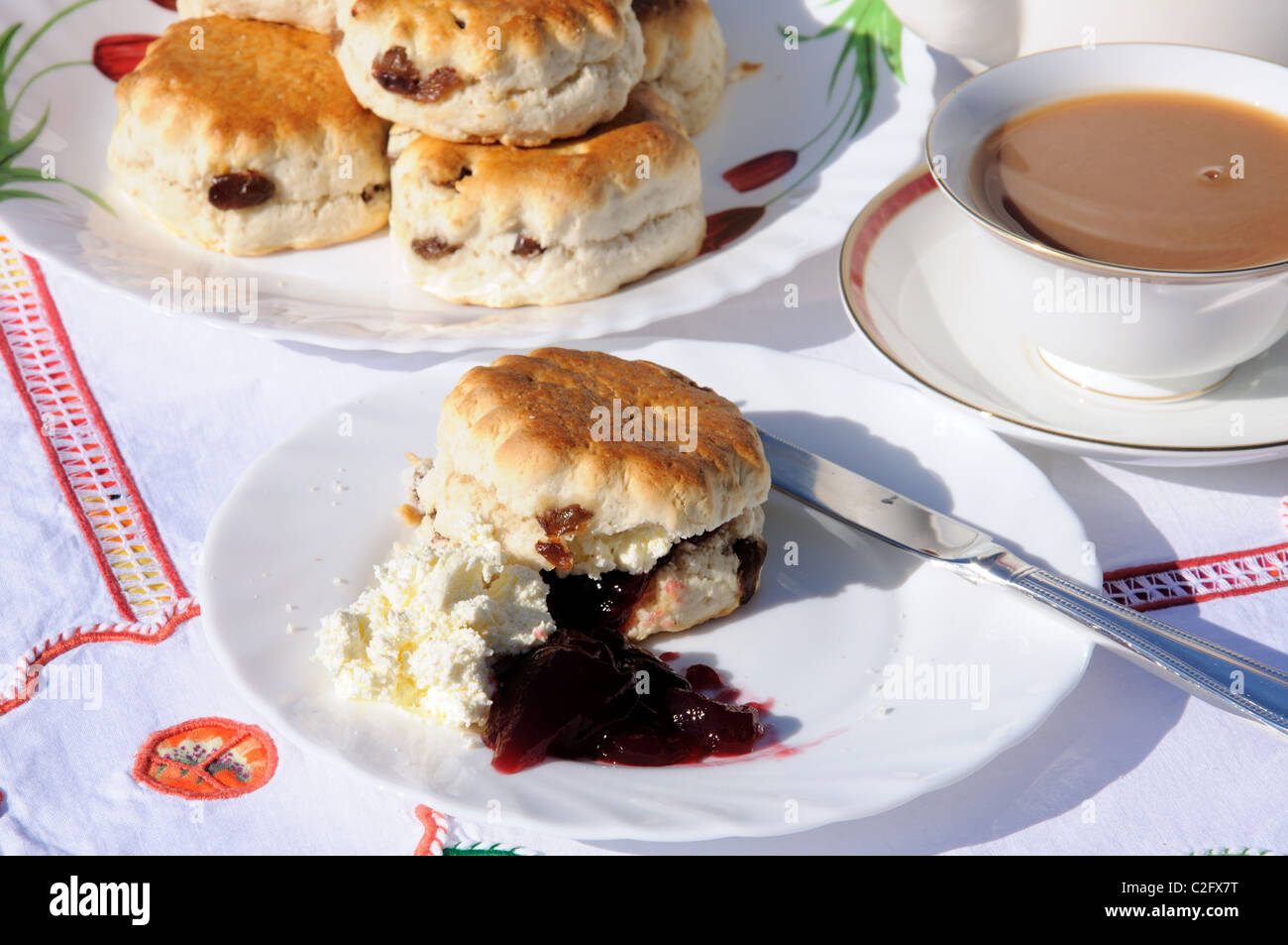 Scones with strawberry jam and clotted cream Stock Photo - Alamy