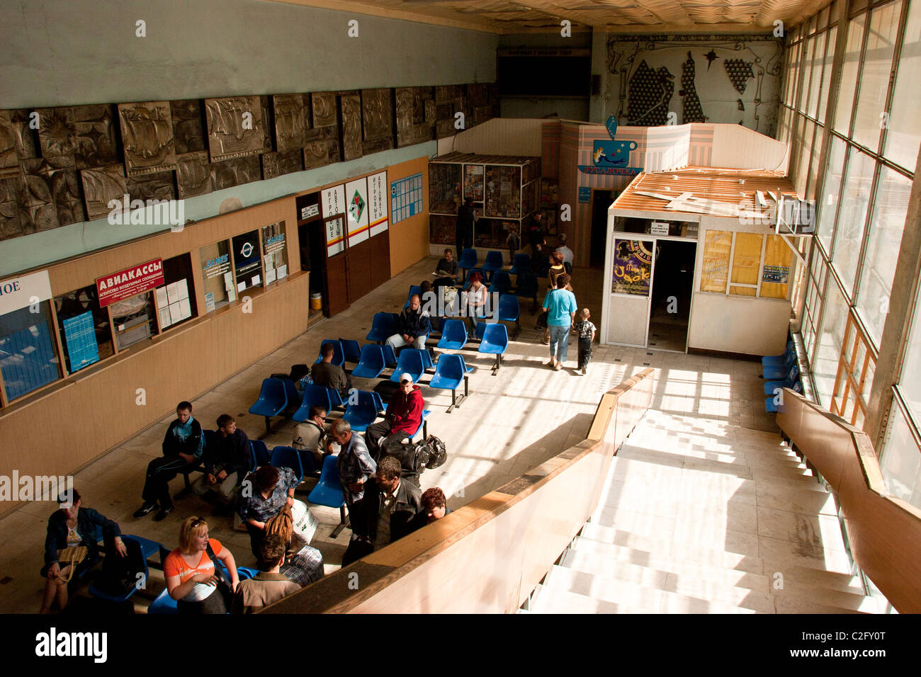 People wait in the main hall of the bus station in Kholmsk, Sakhalin ...