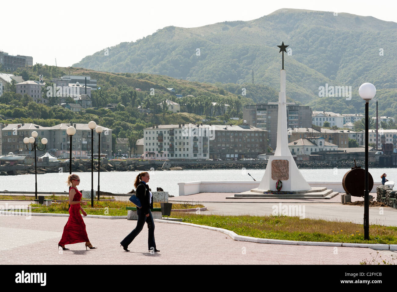 People walk along the waterfront in Kholmsk, Sakhalin, Russia Stock ...